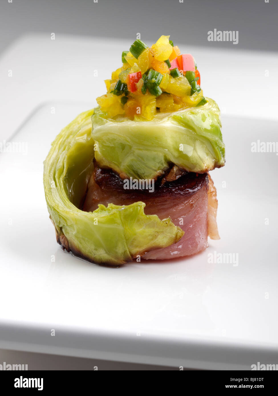 Maple glazed gammon canape with cabbage Stock Photo - Alamy