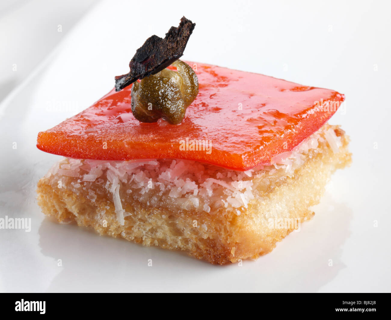 Caper bell pepper tart canape Stock Photo - Alamy