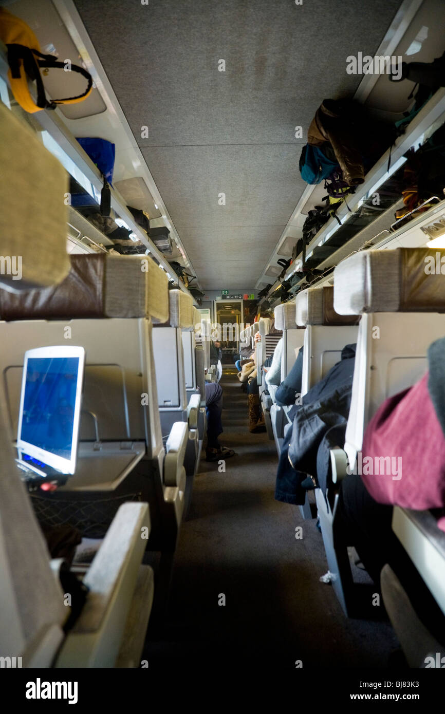 The aisle / corridor, and lap top computer, in a train carriage on the ...