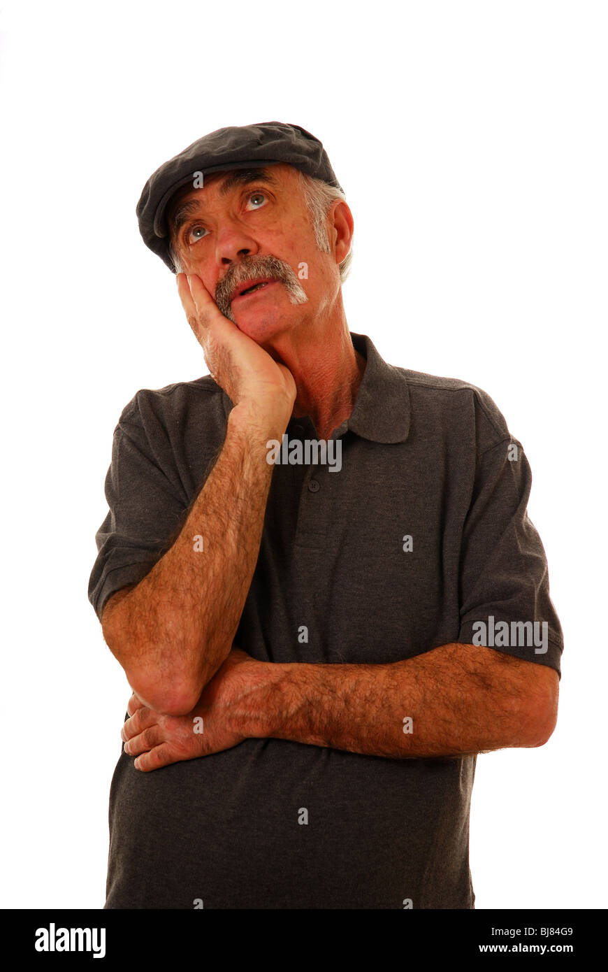 Elderly man deep in thought wondering puzzled Stock Photo - Alamy