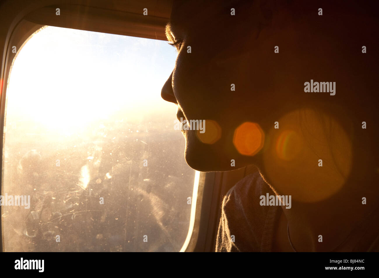 View out an airplane window sun flare hi-res stock photography and ...