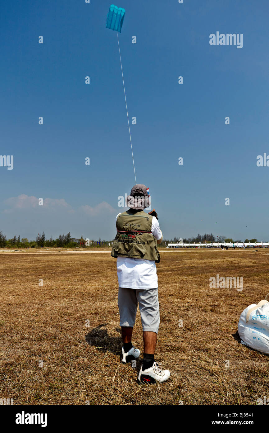Kite flying blue sky. Kite flier at a kite flying event. Thailand S. E ...