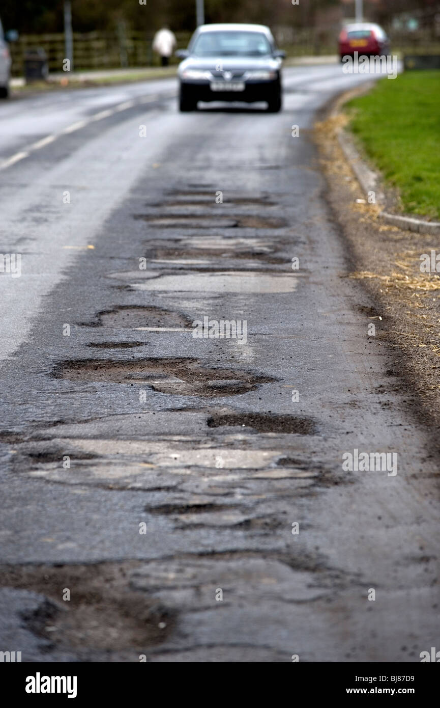 Car approaches potholes in priory hi-res stock photography and images ...