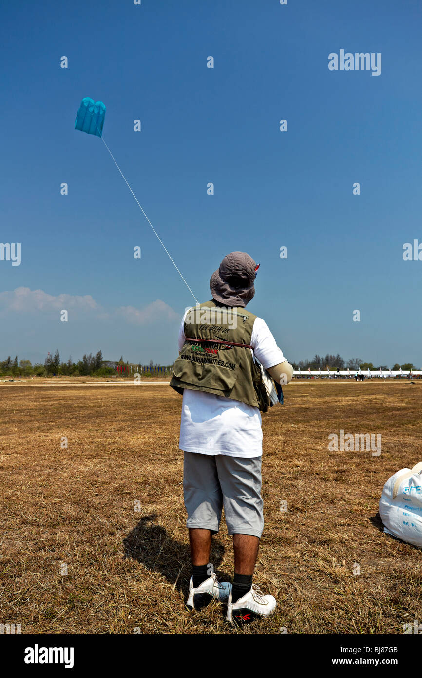 Kite flying blue sky. Kite flier at a kite flying event. Thailand S. E ...