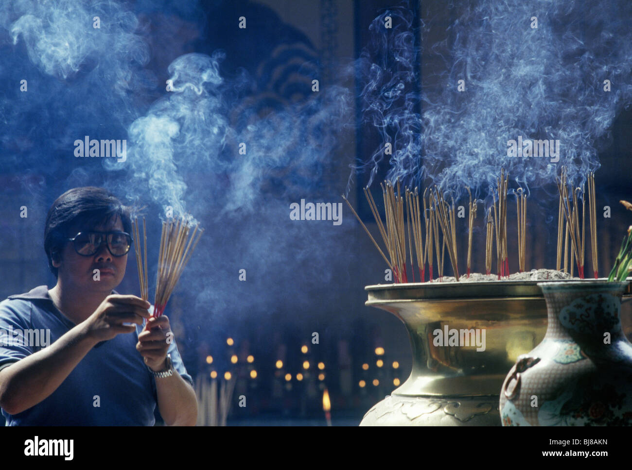Chinese praying joss sticks penang hi-res stock photography and images ...