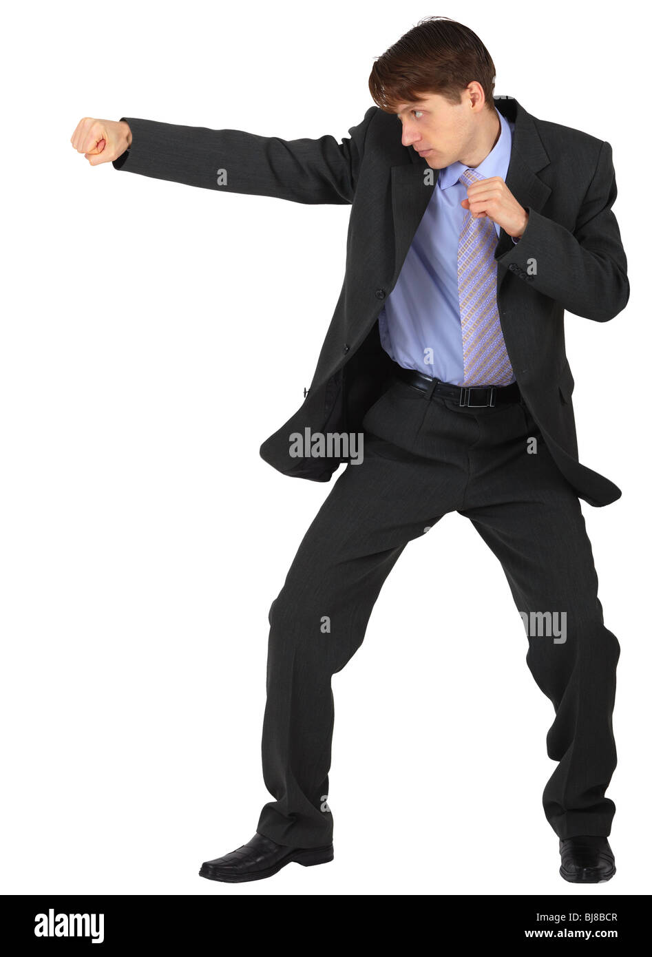 Businessman punching isolated on a white background Stock Photo - Alamy