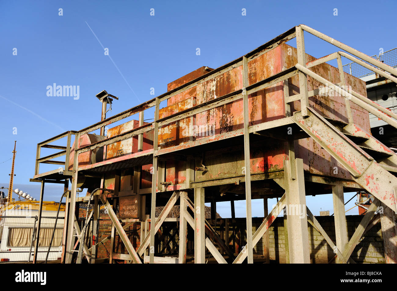 Rusty steel diesel storage tanks on raised platform Stock Photo - Alamy