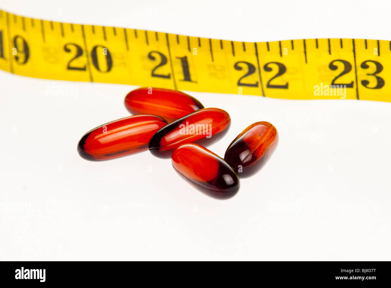 pill and a tape measure Stock Photo - Alamy