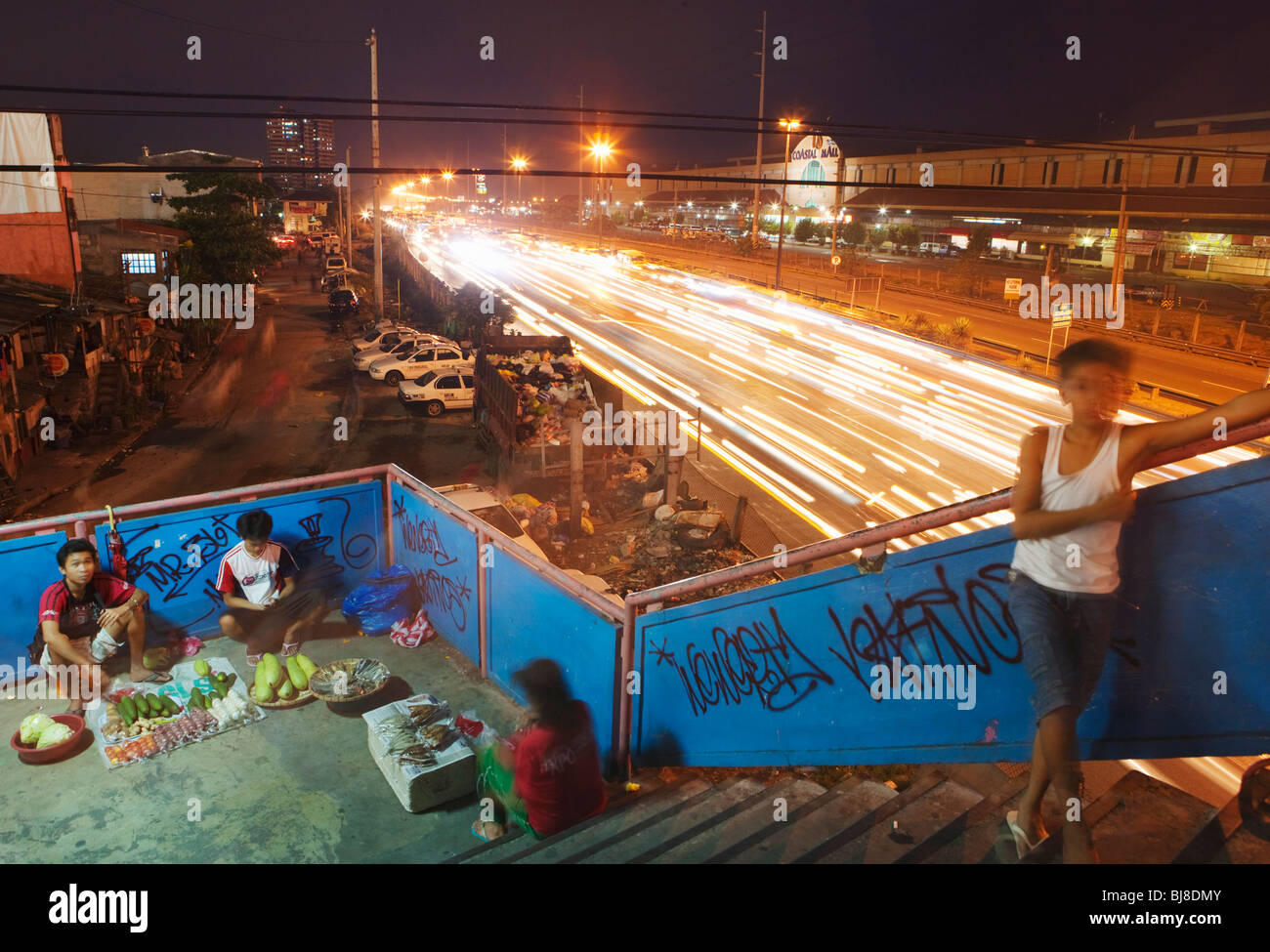Traders on road bridge at night; Manila; Philippines Stock Photo - Alamy
