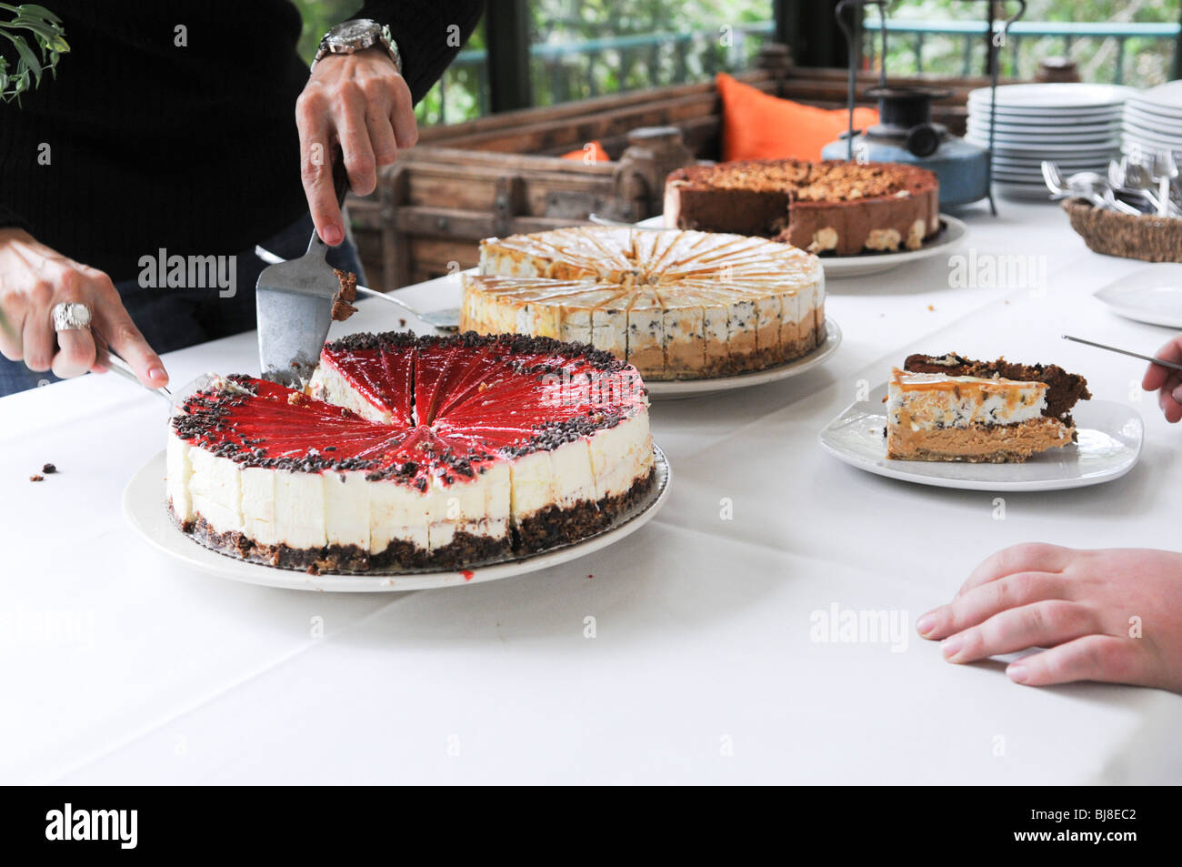 serving cream cake from a buffet dessert table Stock Photo - Alamy