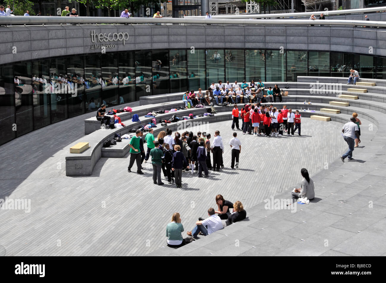 Group of school education trip children in sunshine in the Scoop ...