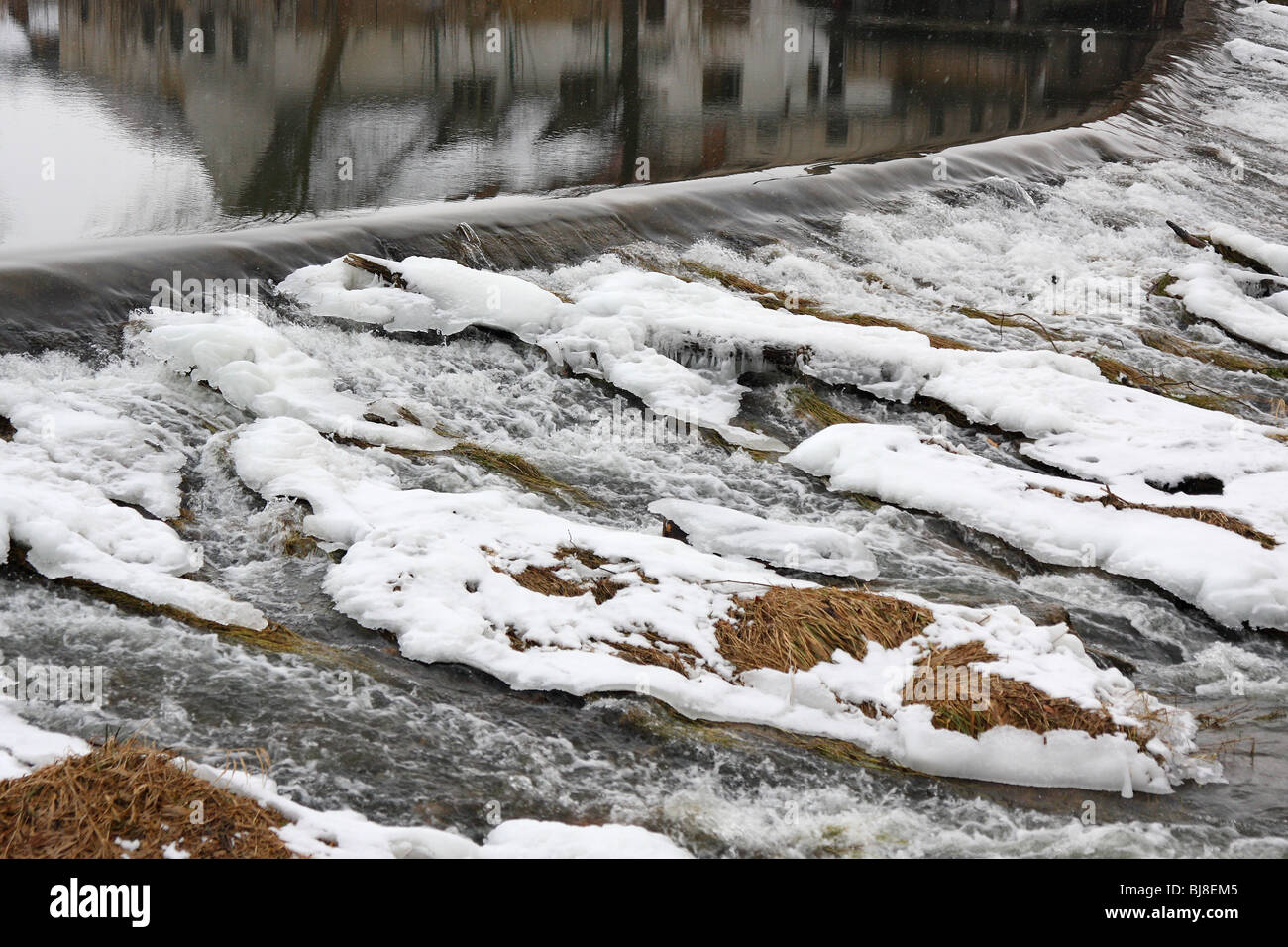 Winter river with ice and waterfall Stock Photo - Alamy