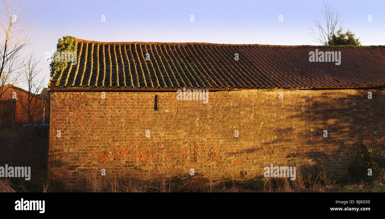 barn on farm buildings made of brick Stock Photo - Alamy