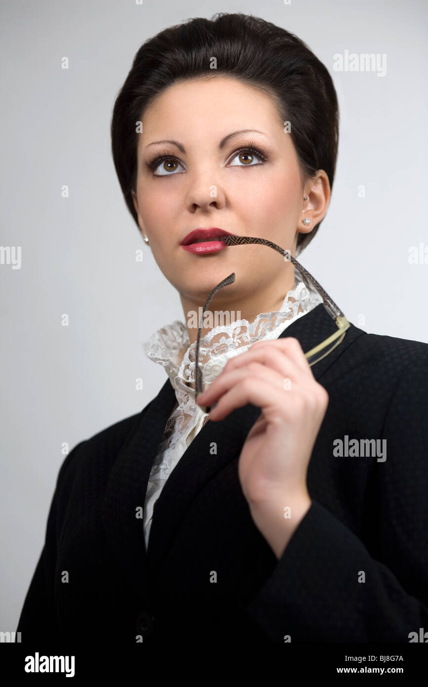 Business woman holding glasses Stock Photo - Alamy
