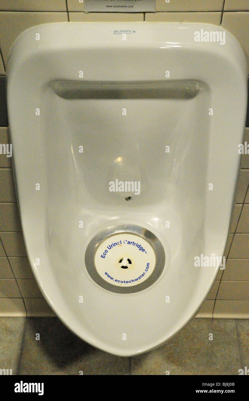 Urinal containing a waterless Eco Urinal Cartridge Stock Photo - Alamy