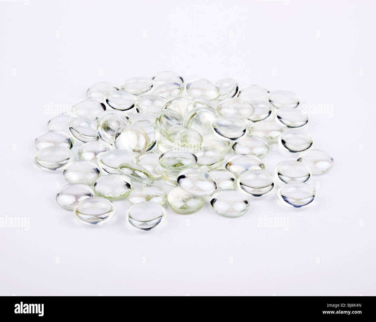 Glass disks on white background Stock Photo - Alamy