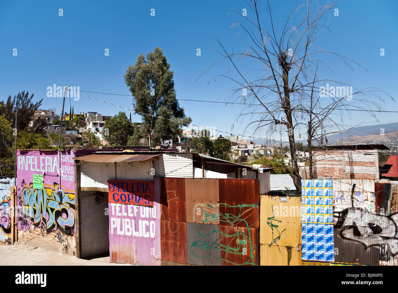 cheerful tin roofed roadside shack above outskirts of Oaxaca has hand ...