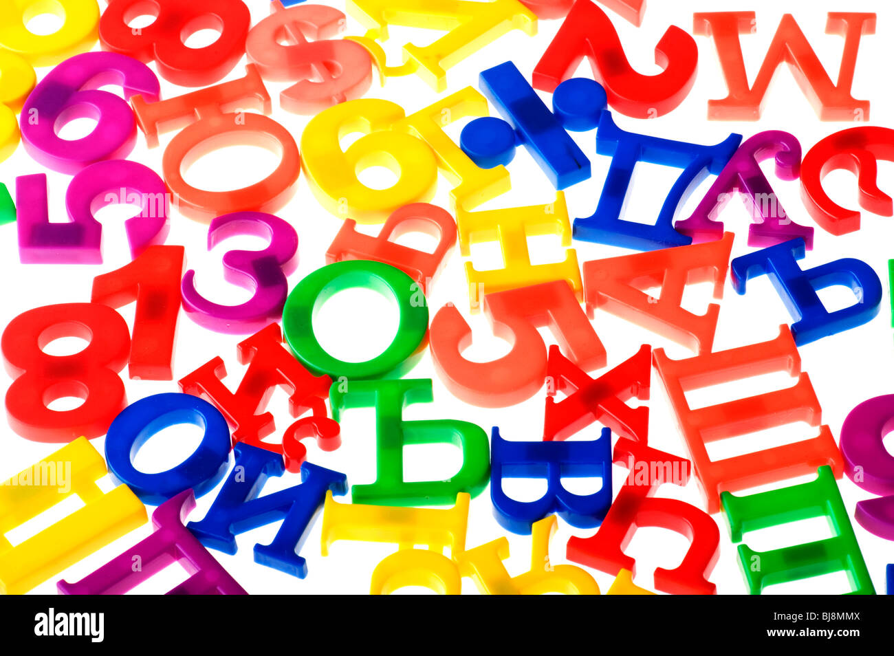 object on white - toy plastic letters and numbers Stock Photo - Alamy
