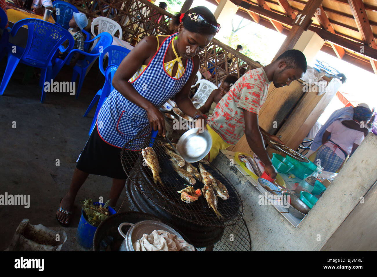 Africa Cameroon Chef Grilled Fish Kribi Men Women Stock Photo - Alamy