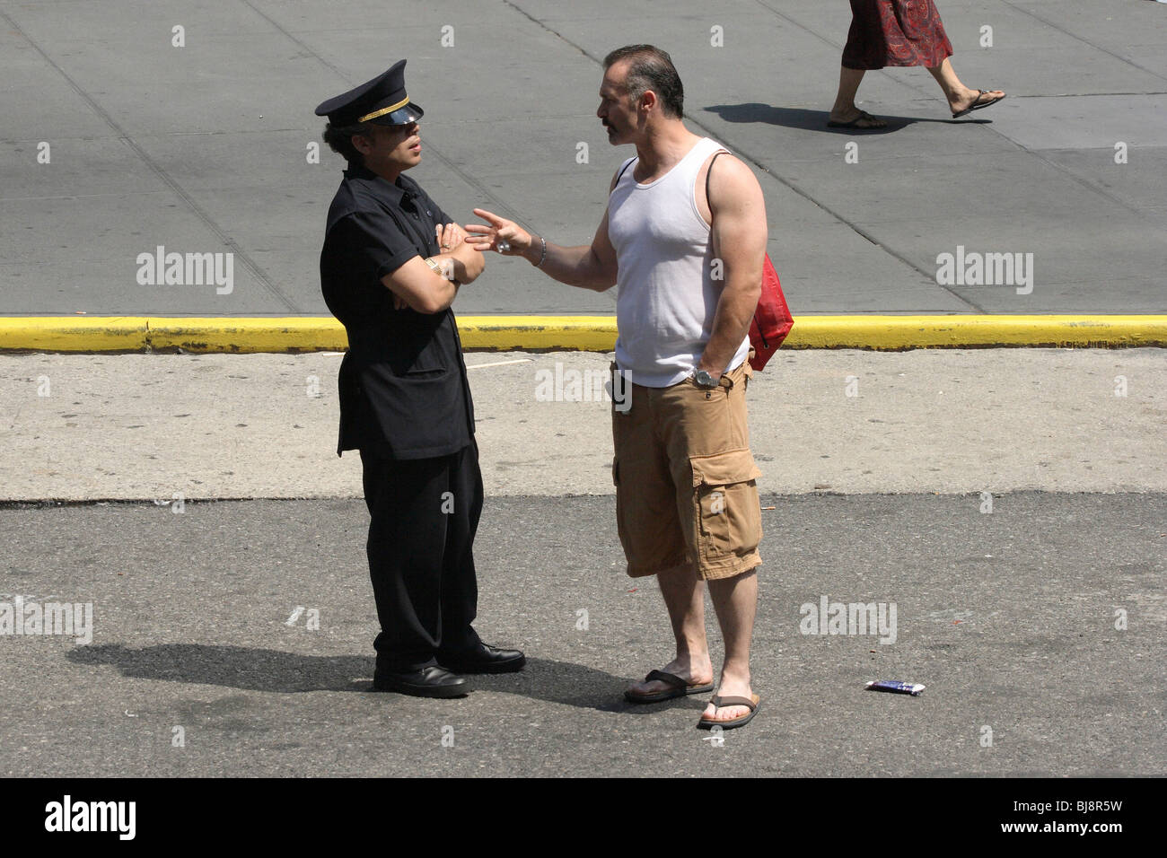 Two men talking in the street, New York City, USA Stock Photo - Alamy