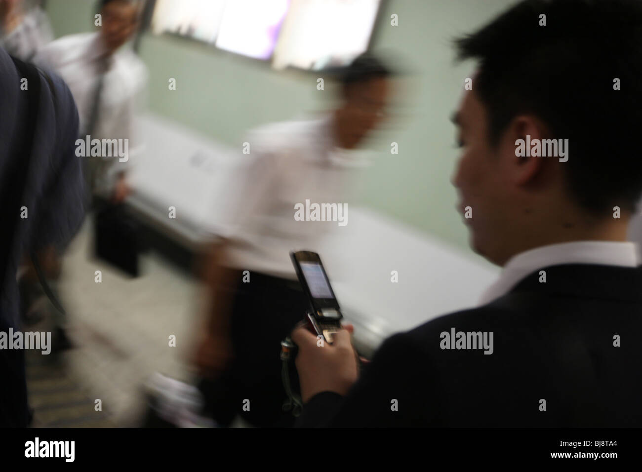 Japanese mobile telephone use by commuters and public in Tokyo, Japan ...