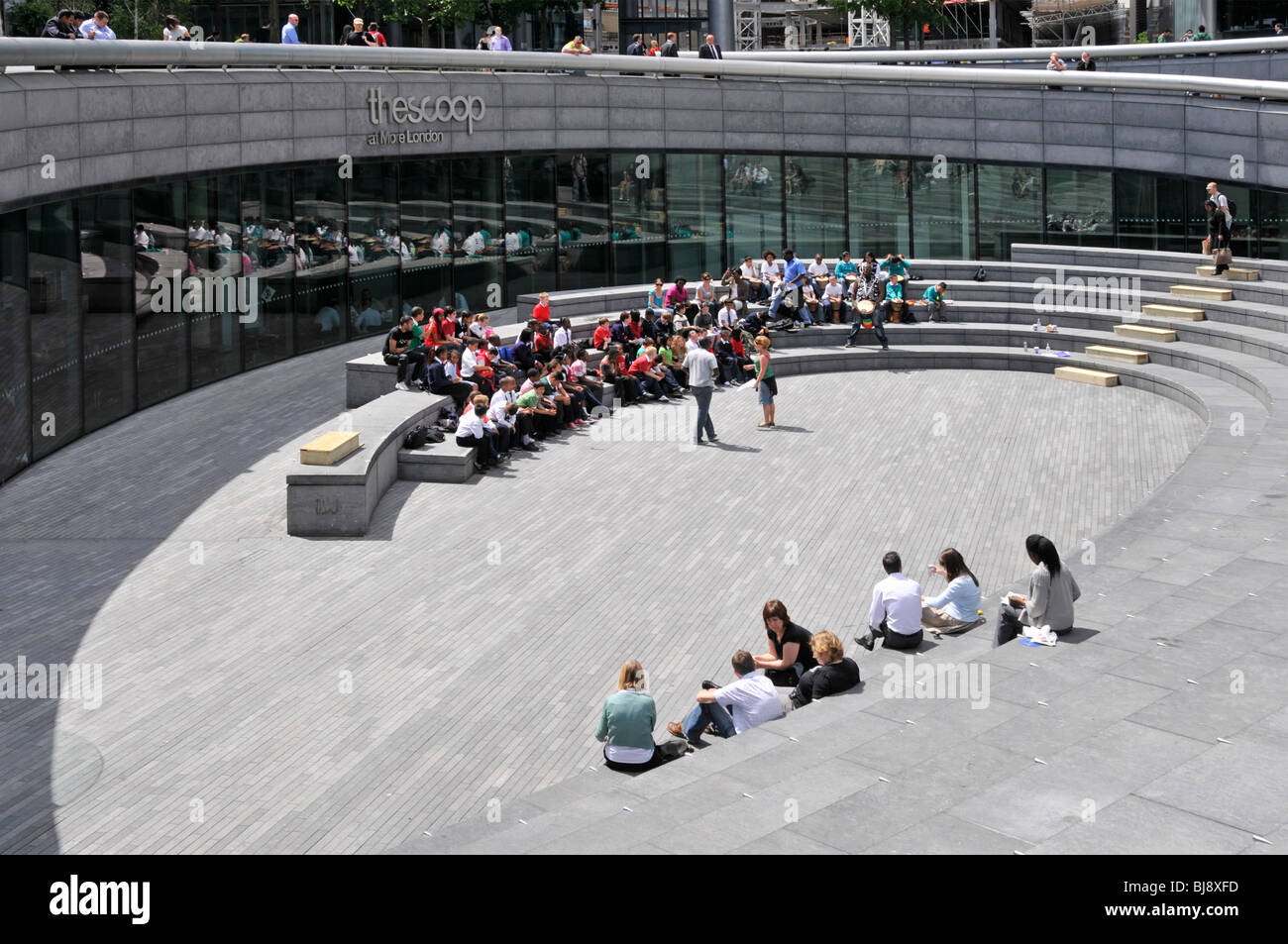 Group of school education trip children in sunshine in the Scoop ...