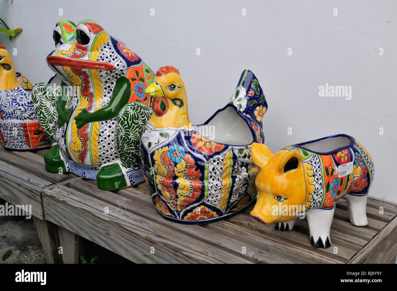 Ceramic plant holders shaped like animal displayed outside a shop in St ...