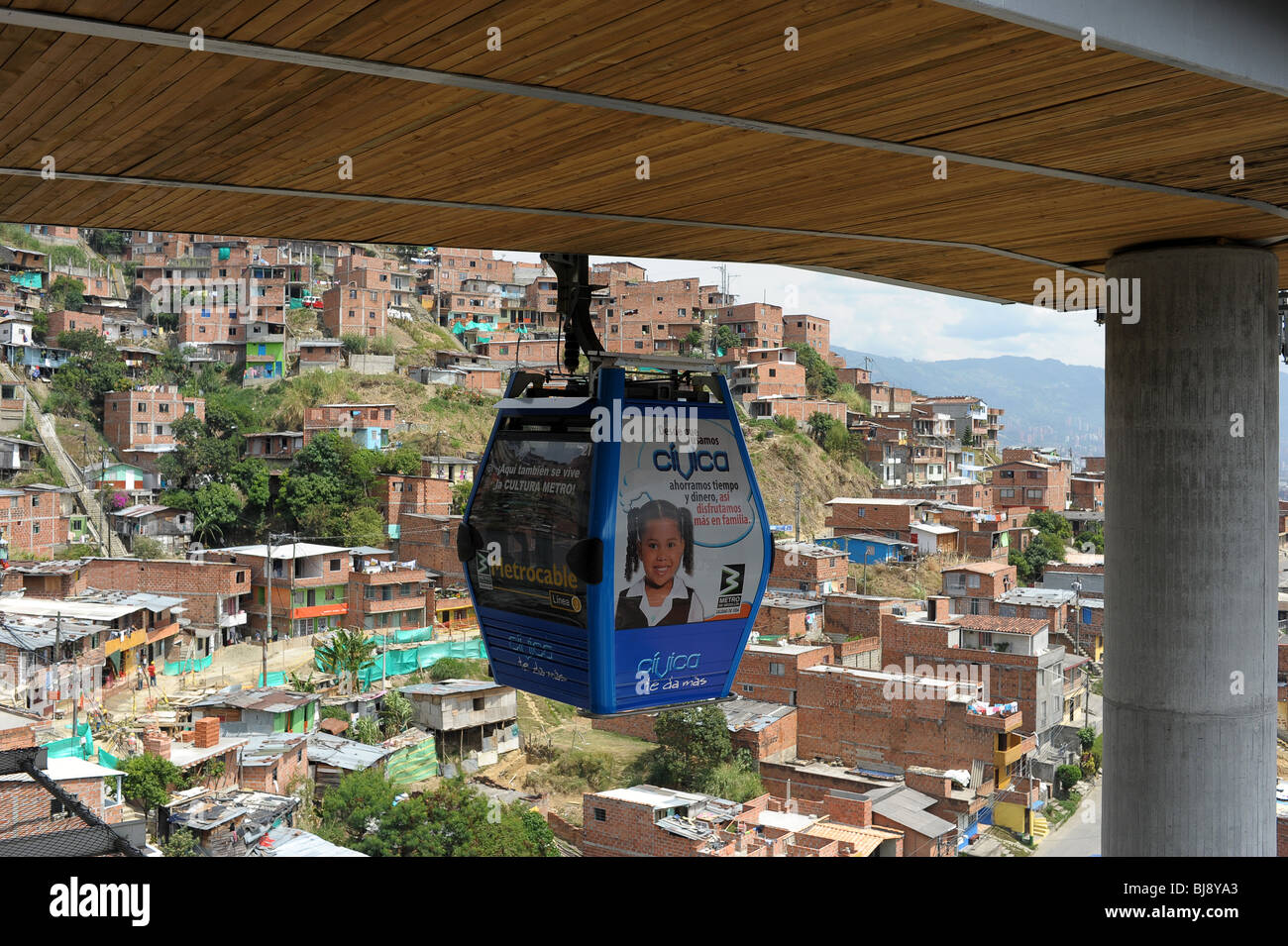 cable car travels over Medellin slums Stock Photo - Alamy
