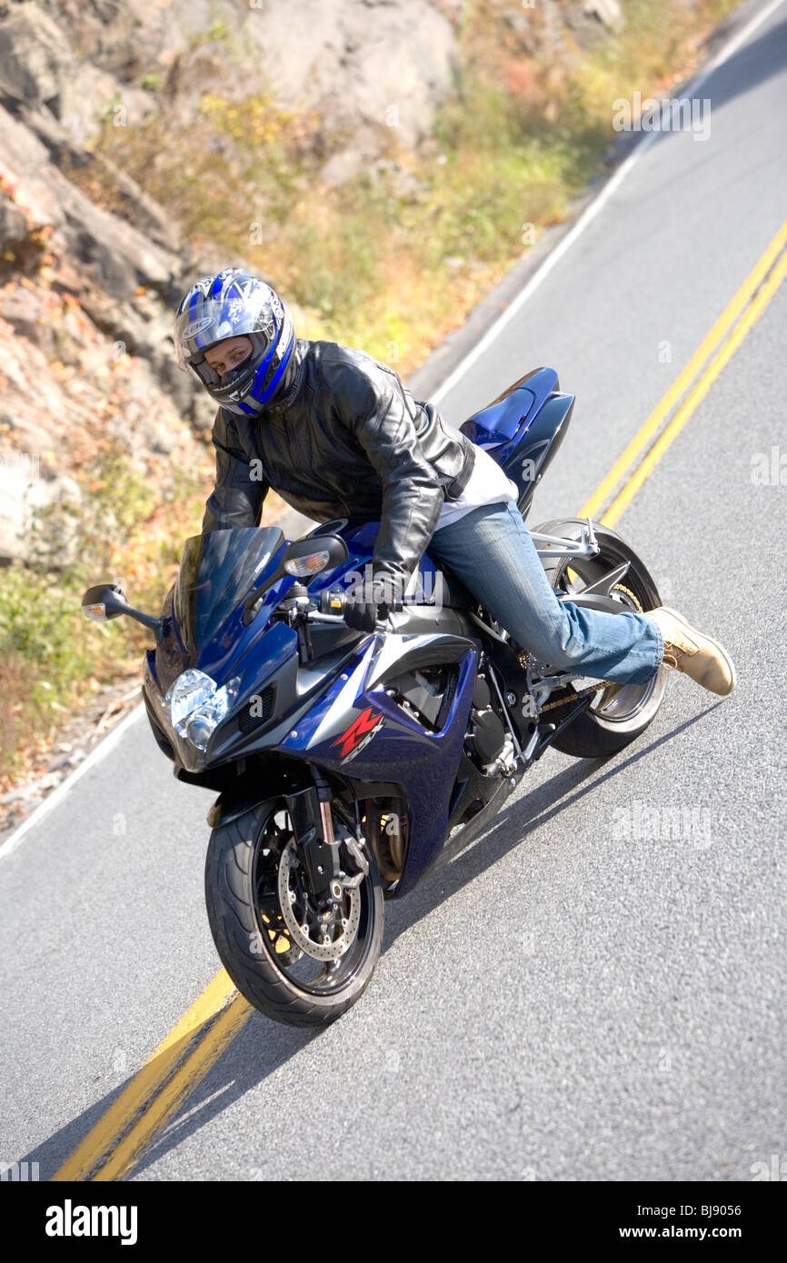 Motorcyclist on the road Stock Photo - Alamy