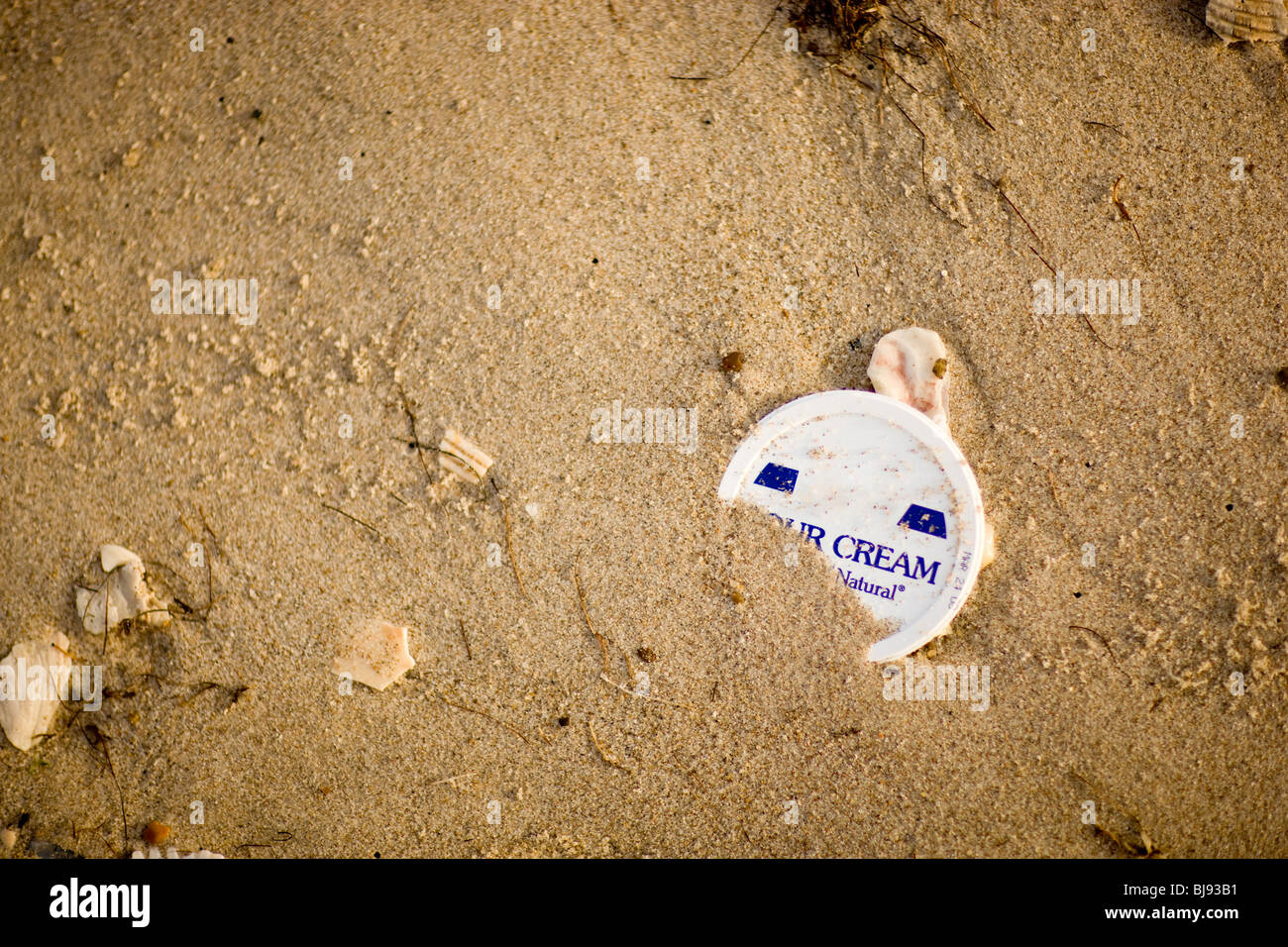 Garbage in the sand on the beach Stock Photo - Alamy