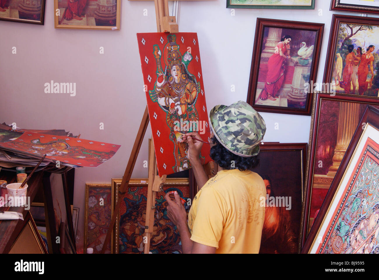 A Young Indian talented Painter paints his new professional artistic ...