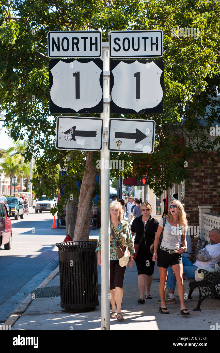 Key West, FL - Dec 2008 - Woman tourist looking up at Highway 1 road ...