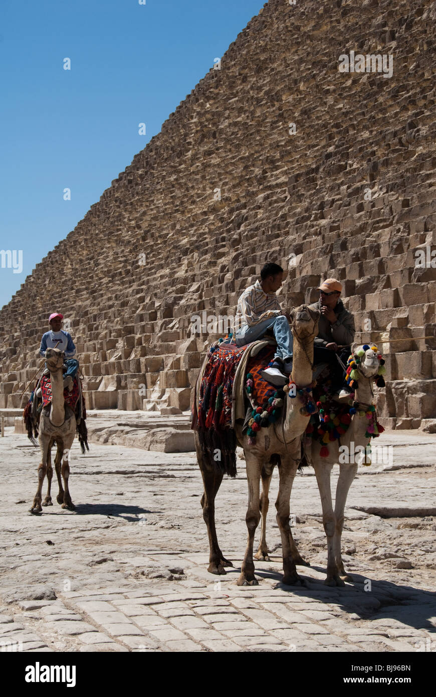 Camel Riders at the Great Pyramids Giza Egypt Stock Photo - Alamy