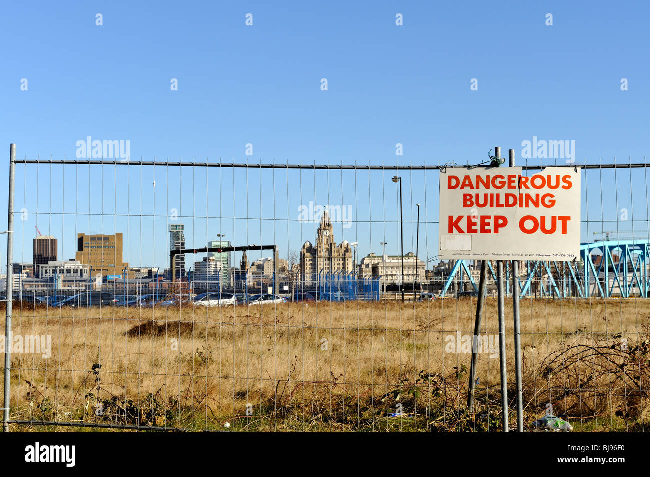 Dangerous Building Keep Out Liverpool Liver Buildings behind fence ...