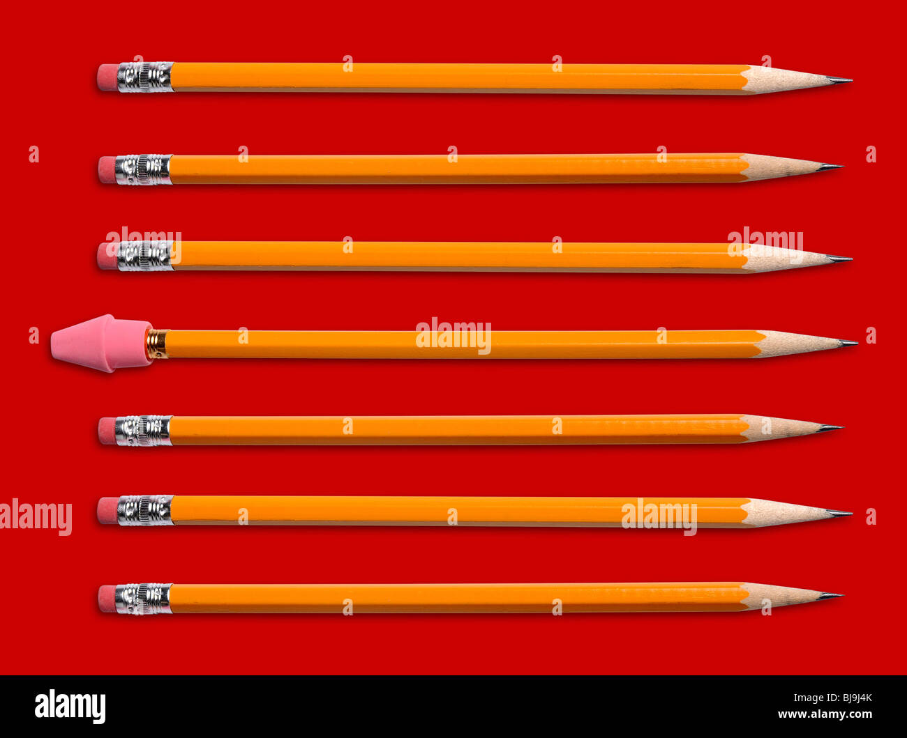 Yellow pencils with two different kinds of erasers isolated over white ...