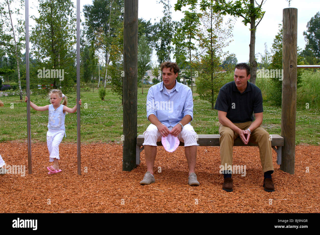 Adult observing children playing hi-res stock photography and images ...