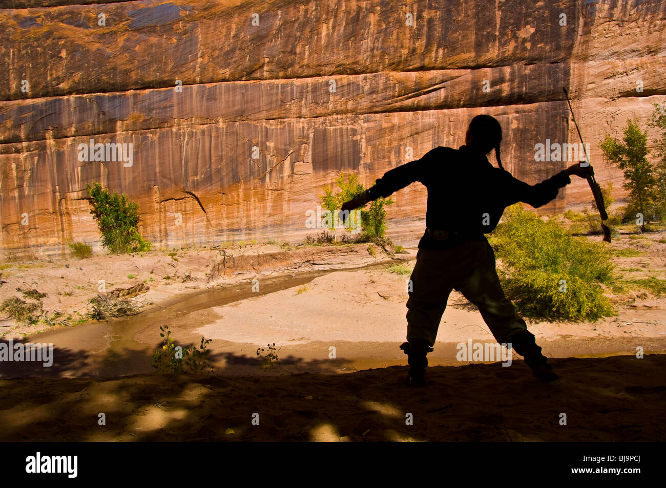 navajo warrior demonstrating his prowess with a spear in Canyon de ...