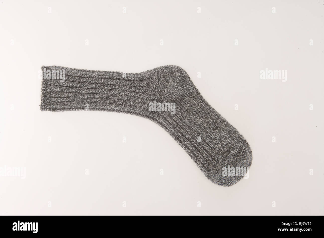 grey ribbed wool sock on white background Stock Photo - Alamy