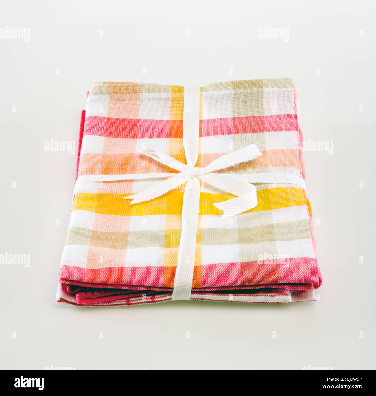 tea clothes folded on white background Stock Photo - Alamy