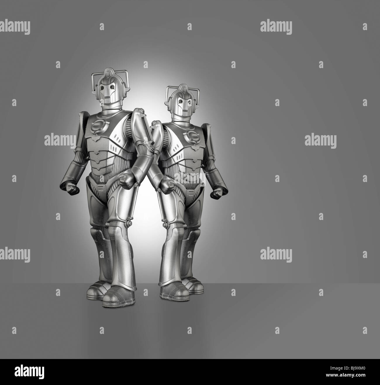 Two Robot man on silver background Stock Photo - Alamy