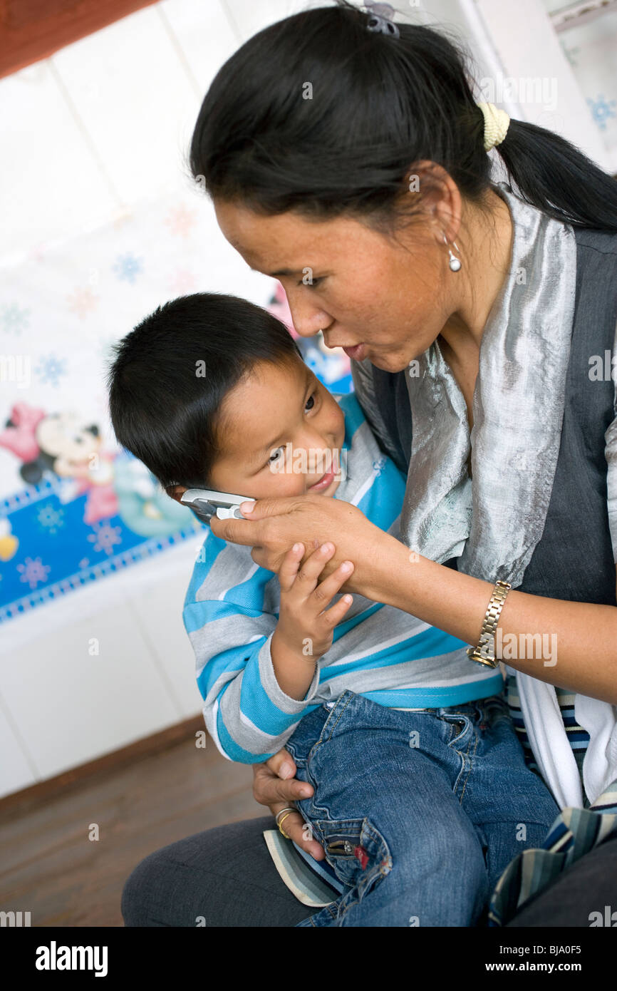 Teacher with child at Tibetan Children's Village, McLeod Ganj, India ...