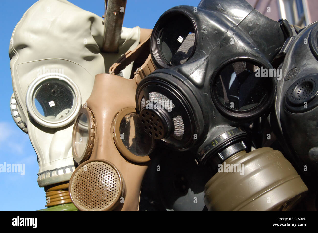 Gas masks on a stand in Notting Hill market, London Stock Photo - Alamy