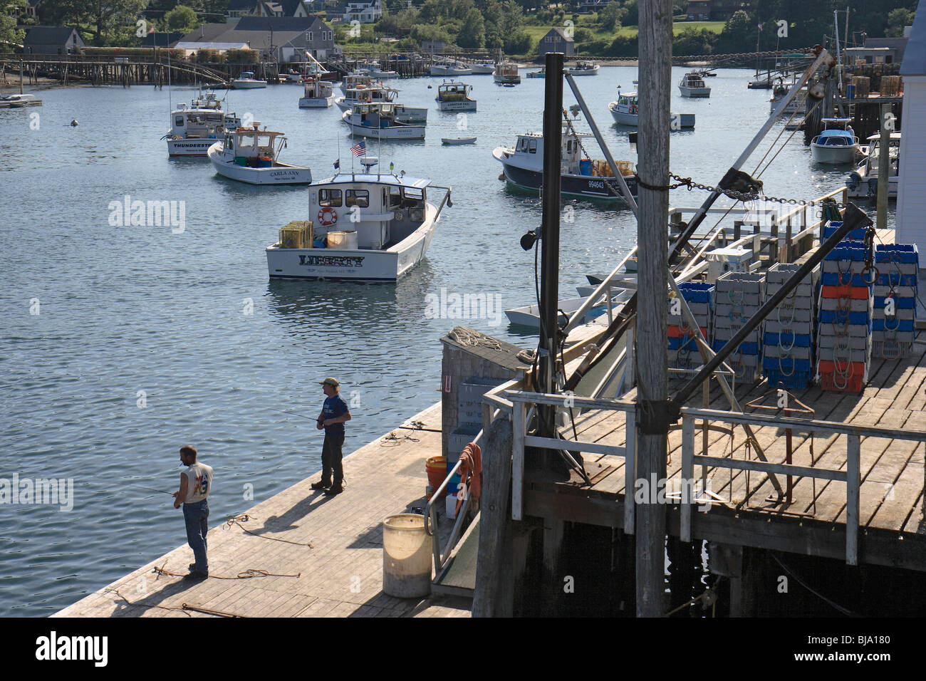 Fishing with rod in harbour pier hi-res stock photography and images ...