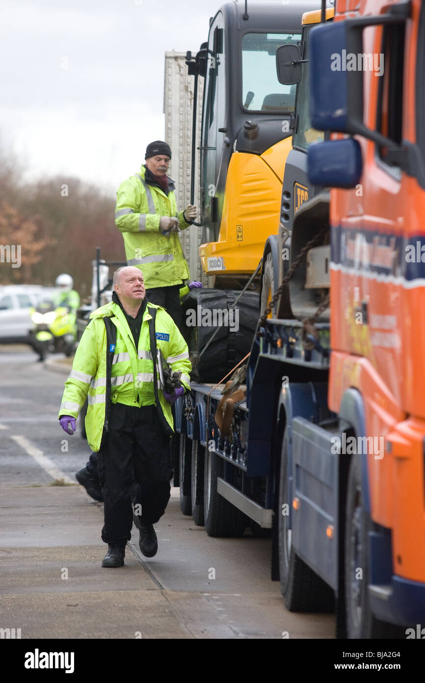 VOSA officers checking a lorry loaded with earth movers Stock Photo - Alamy