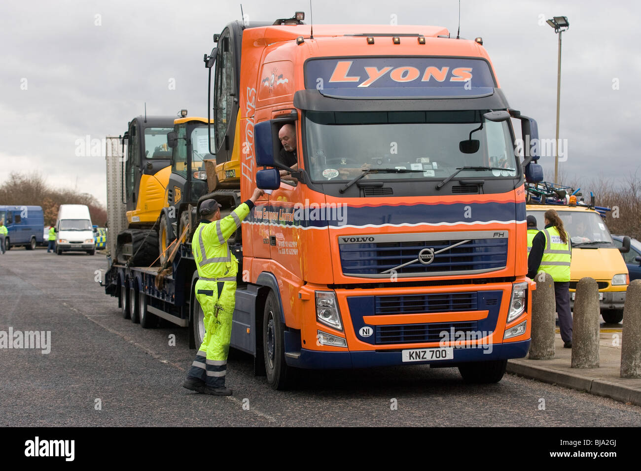 VOSA officers checking a lorry loaded with earth movers Stock Photo - Alamy