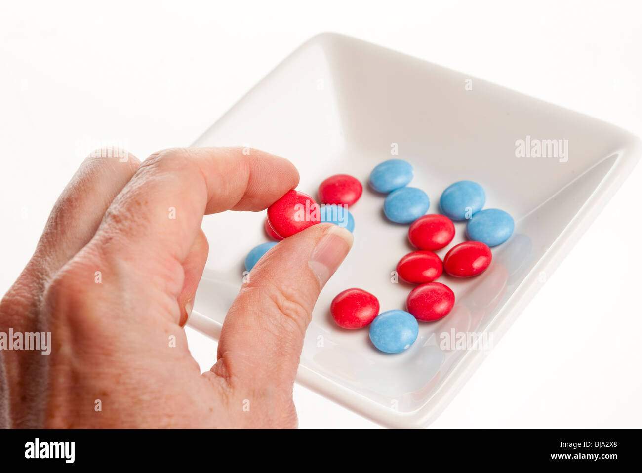 taking a pill sweet Stock Photo - Alamy