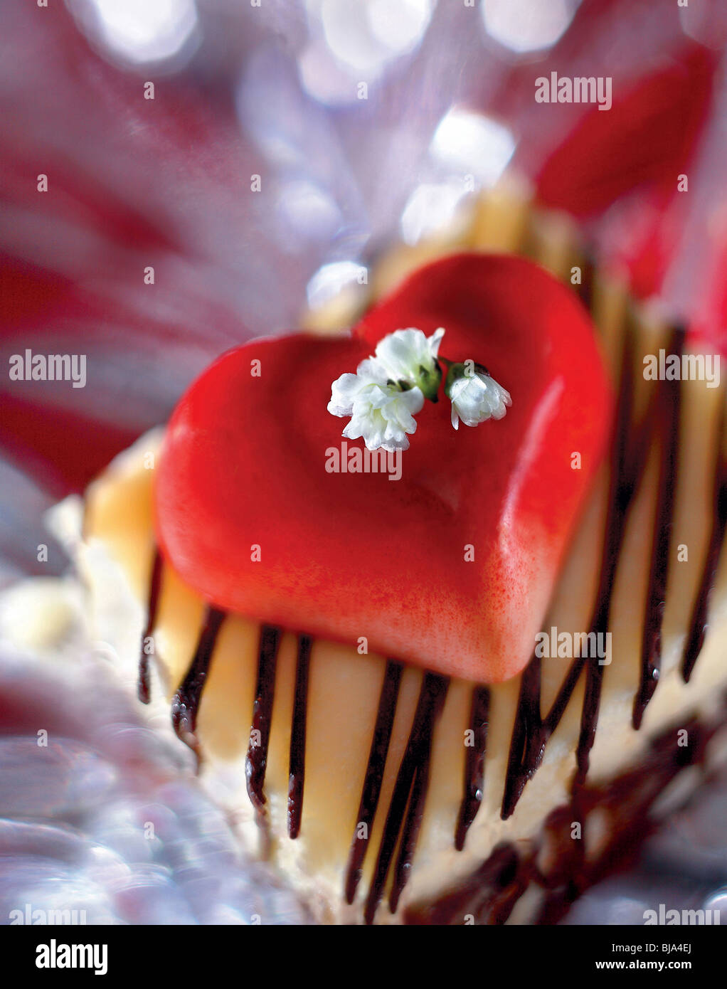 Cake Topped with Heart and Edible Flowers - clipping path Stock Photo ...