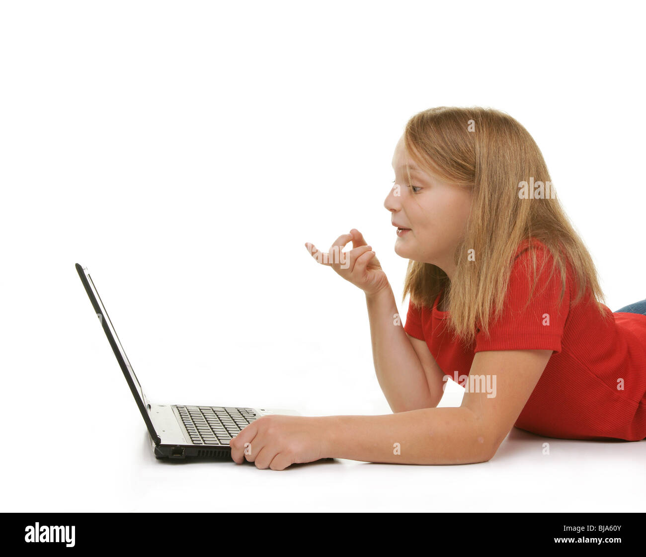young girl looking and pointing at laptop Stock Photo - Alamy