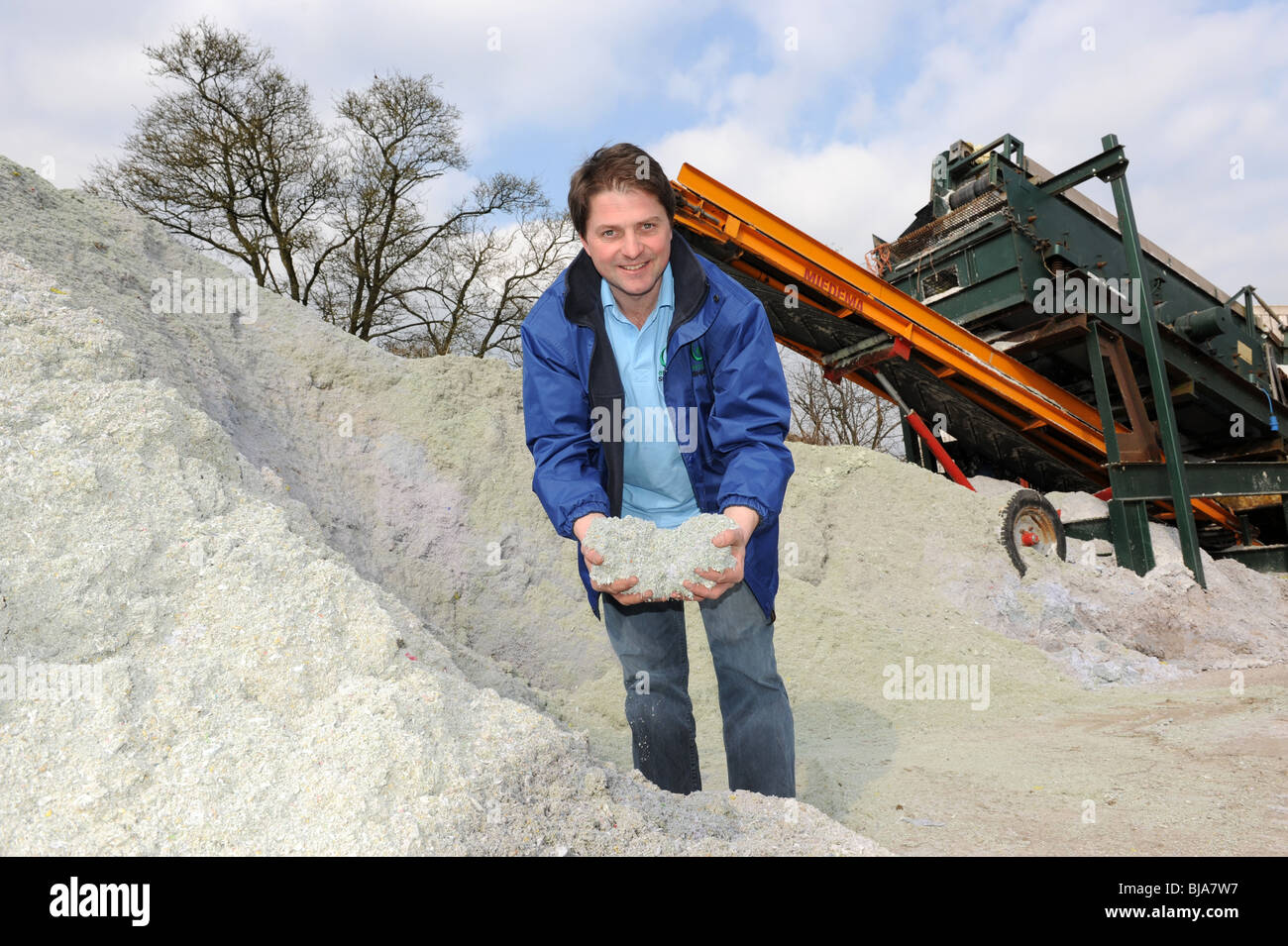Herefordshire farmer Andrew Bayliss with mountain of shredded waste ...