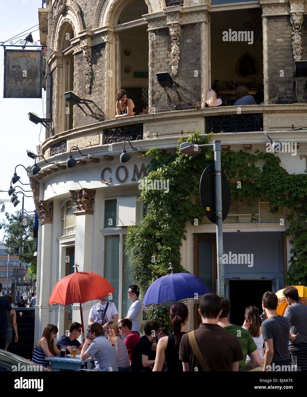 Woman climbing out window hi-res stock photography and images - Alamy